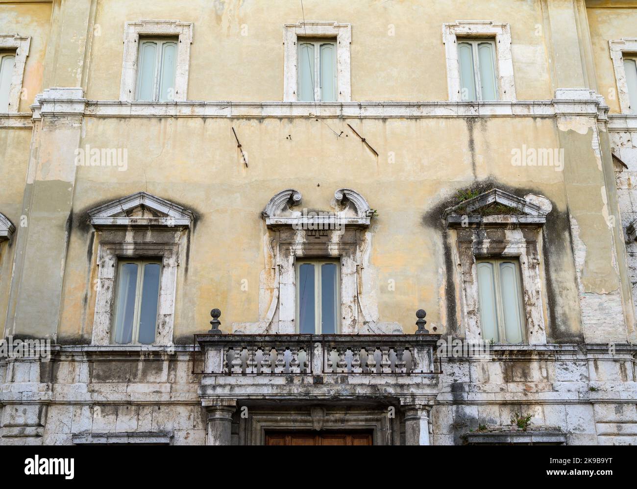 Details of front facade of a run-down, old and grand house on Freedom ...