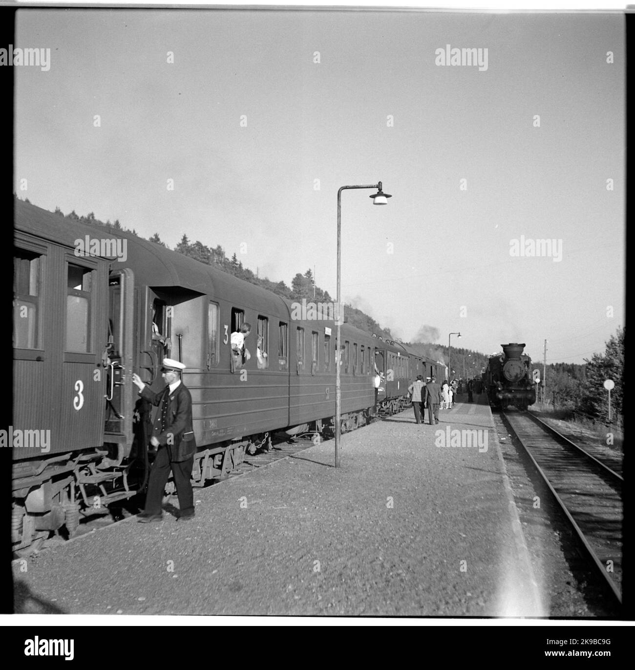 Passenger trains in the station. The stroller in the middle is the ...