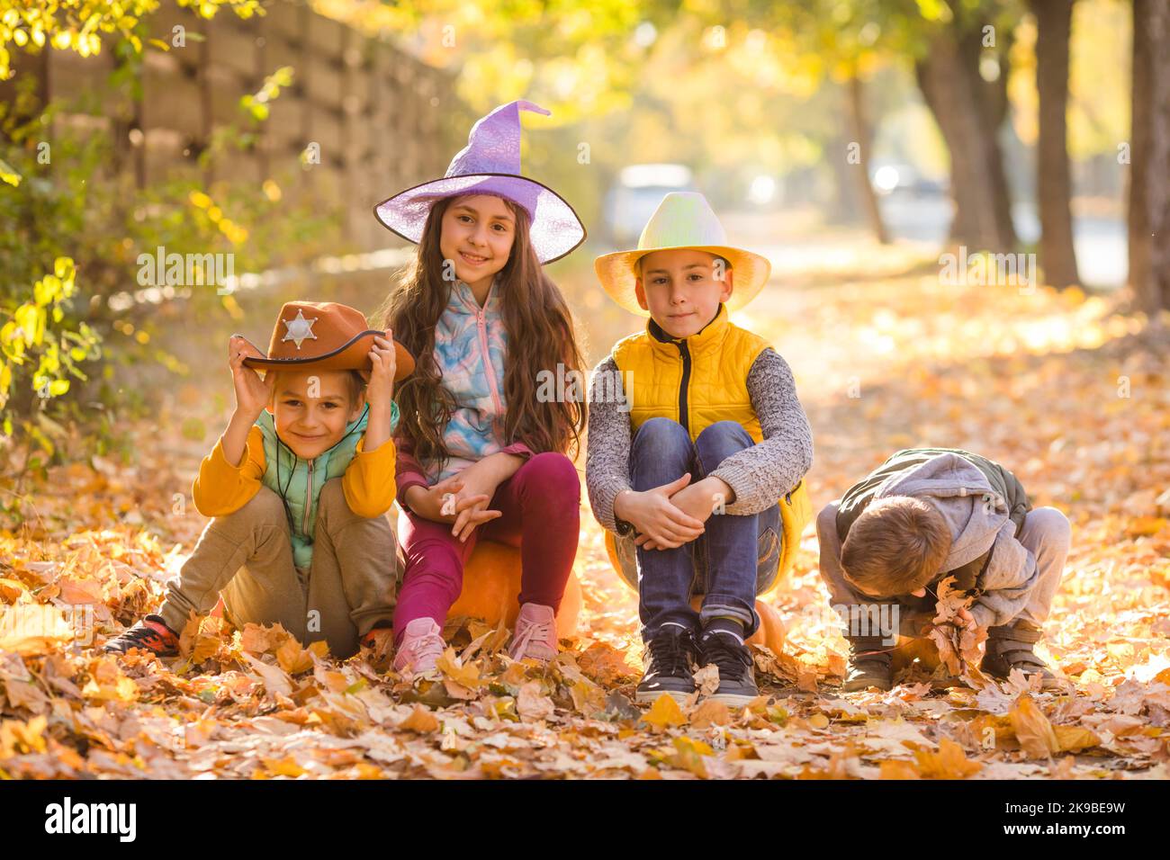 Group of little kids enjoying harvest festival celebration at pumpkin ...