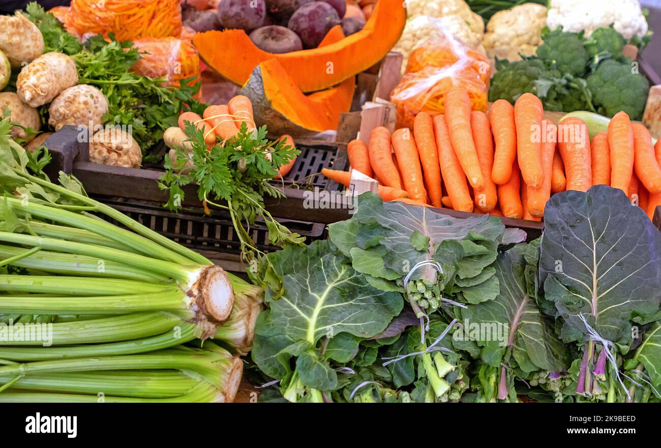 Fresh organic leaf green vegetables piles sold on market stall Stock ...