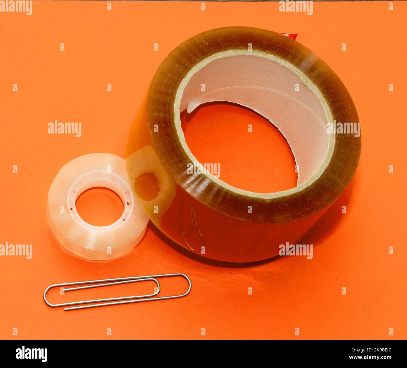 Heavy duty shipping packaging sticky tapes isolated on orange ...