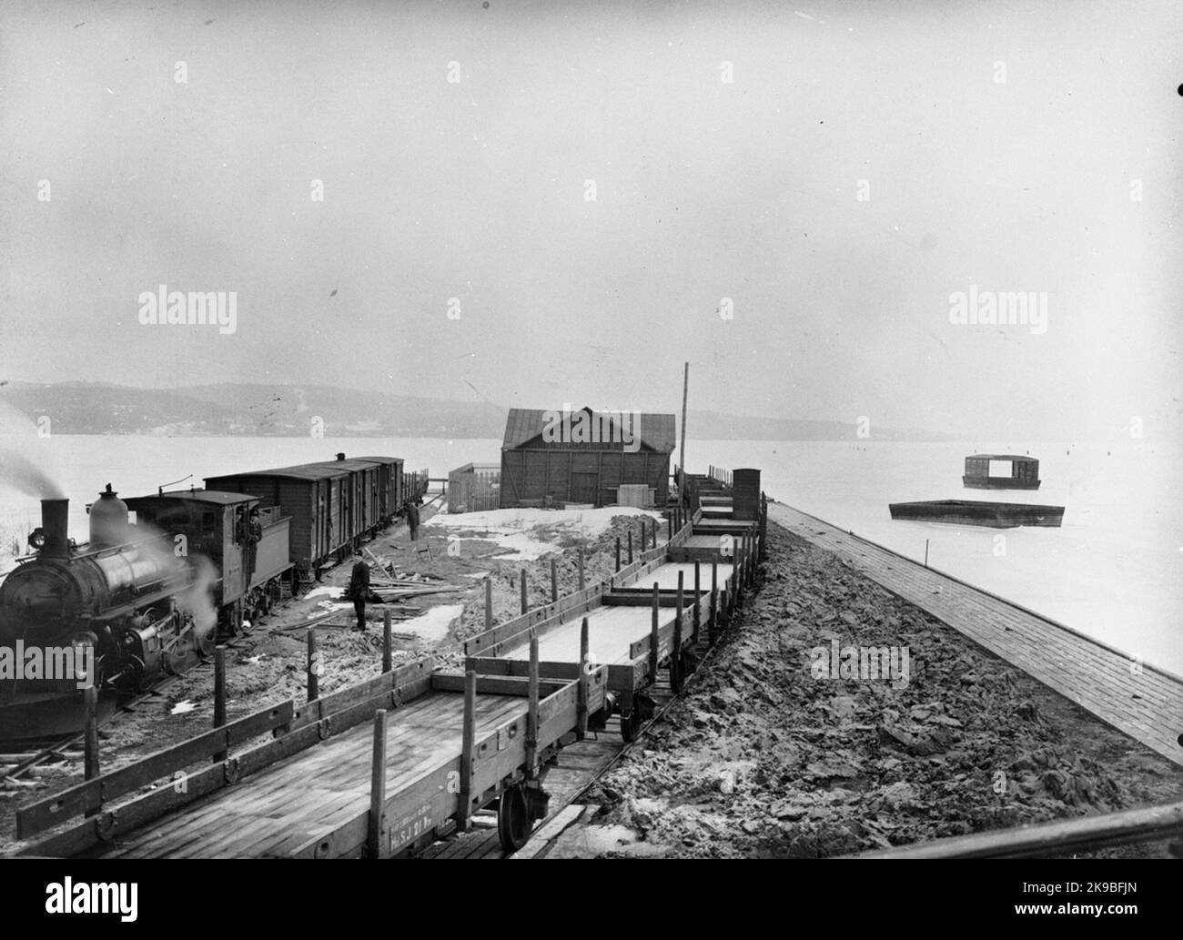 The harbor track with steam locomotives and wagons Stock Photo - Alamy