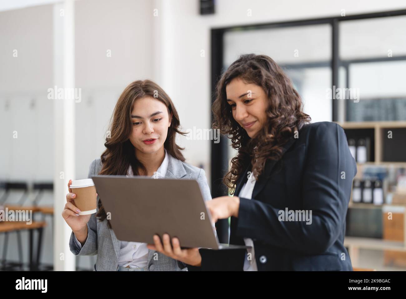 Diverse businesspeople cooperate work together discussing company financial statistics ...