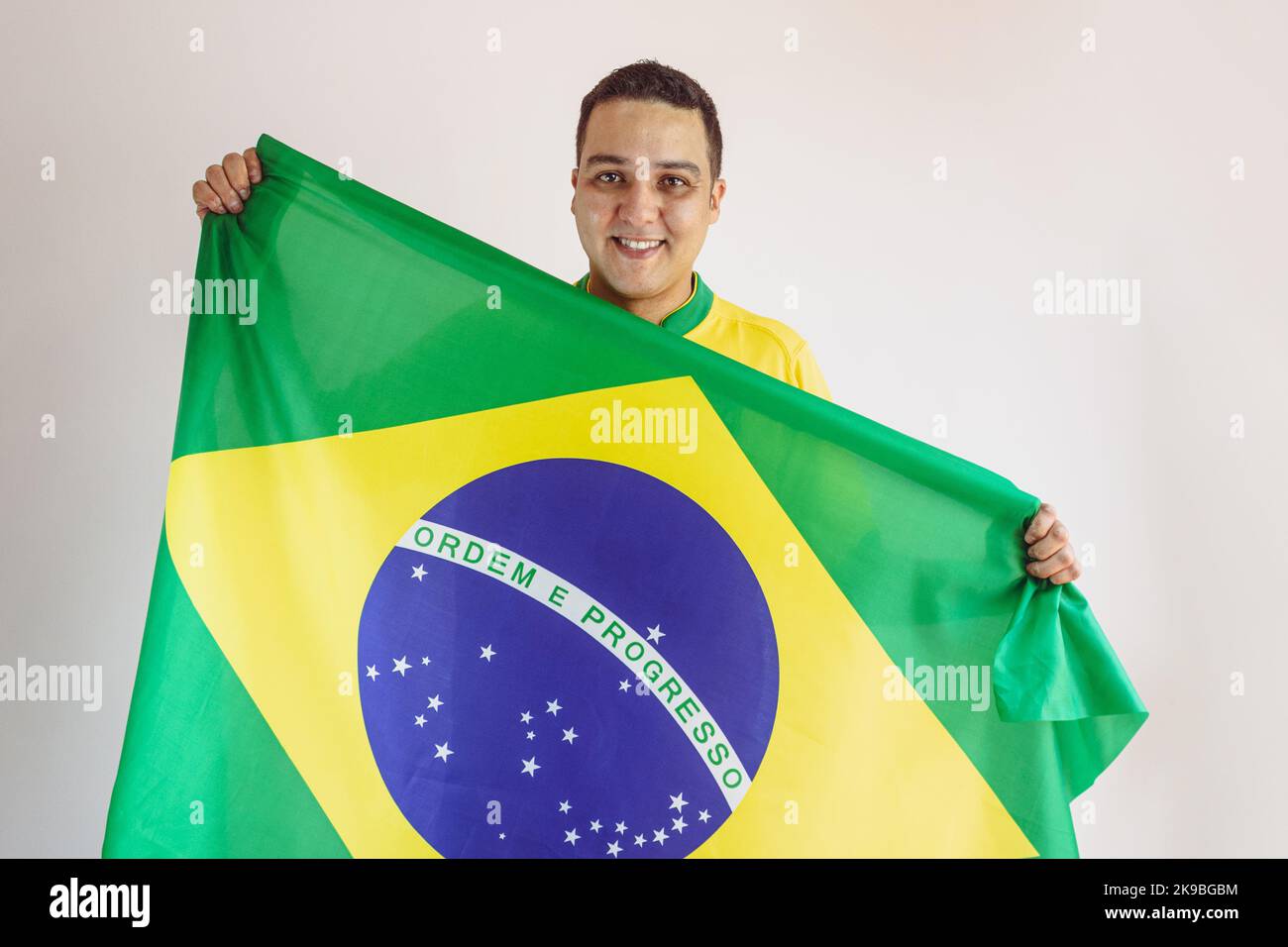 Black Man Holding Brazilian Flag With Soccer Team Yellow Shirt Isolated ...
