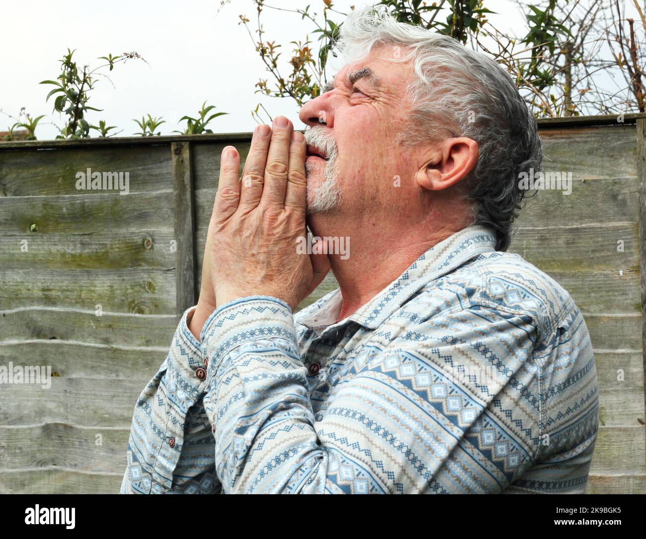 Man praying to God. Hands clasped together and looking to Heaven ...
