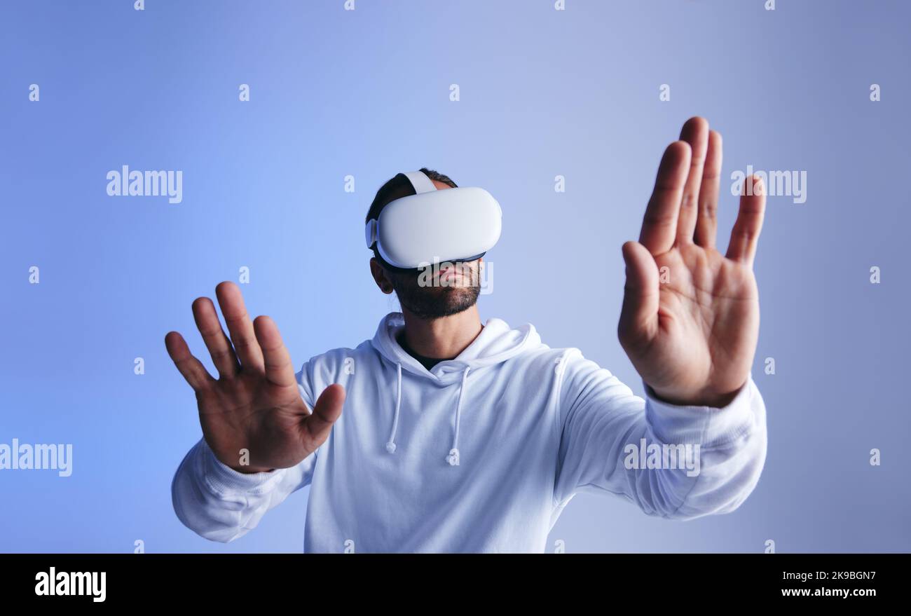 Curious young man touching virtual space with his hands. Young man ...