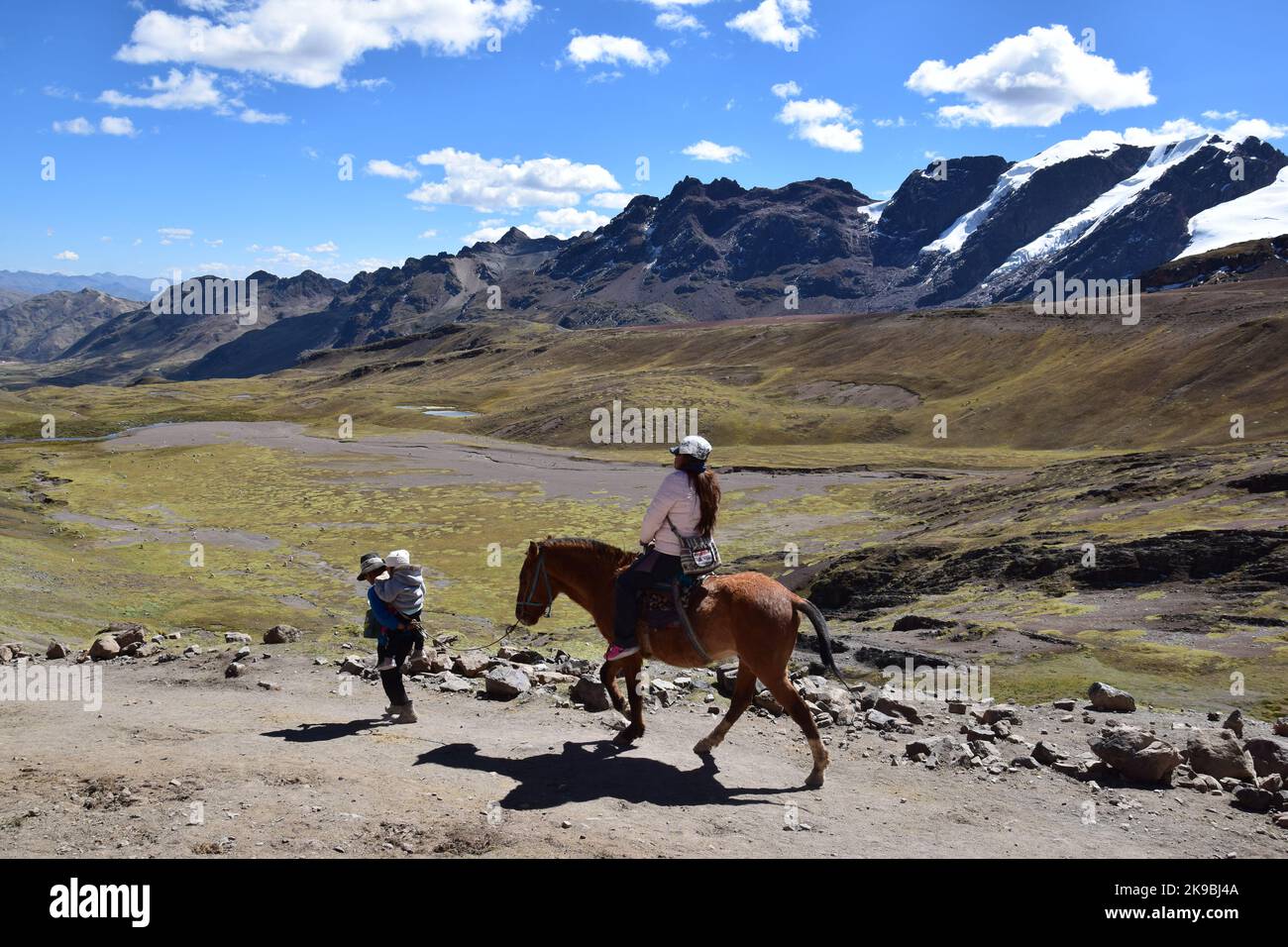 Local dressed in traditional clothing walking up the hill with his ...