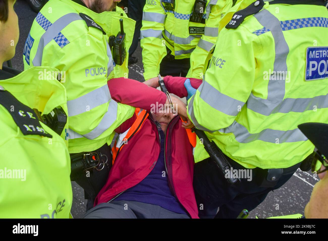 London, England, UK. 27th Oct, 2022. Police officers arrest an elderly ...