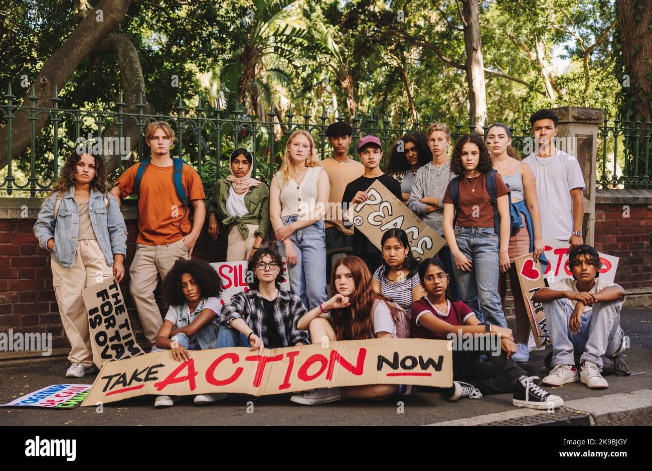 Group of multiethnic youth activists looking at the camera while ...