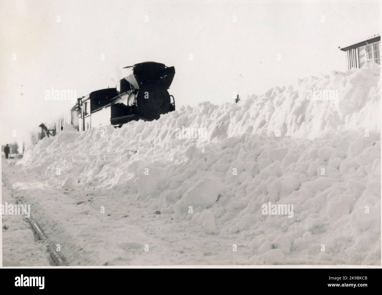 Steam locomotive behind snowfall Stock Photo - Alamy