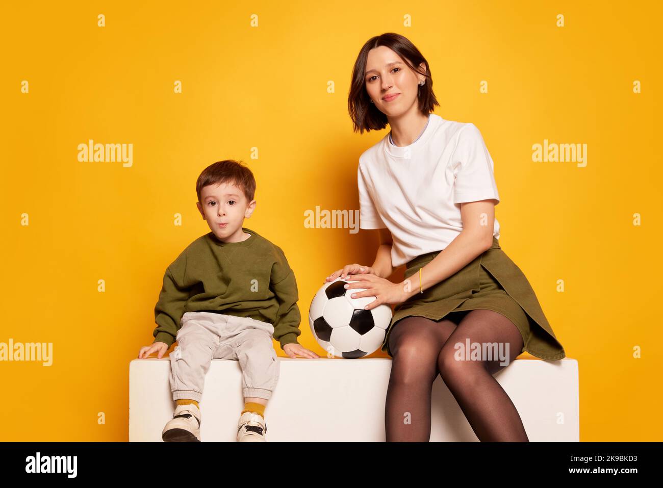 Cheerful mother son football hi-res stock photography and images - Alamy