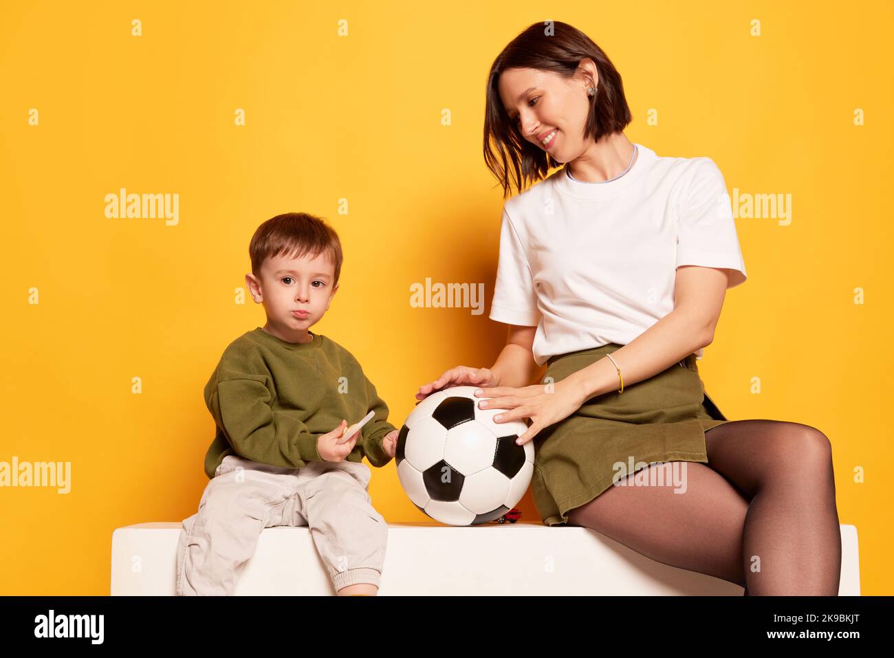 Cheerful mother son football hi-res stock photography and images - Alamy