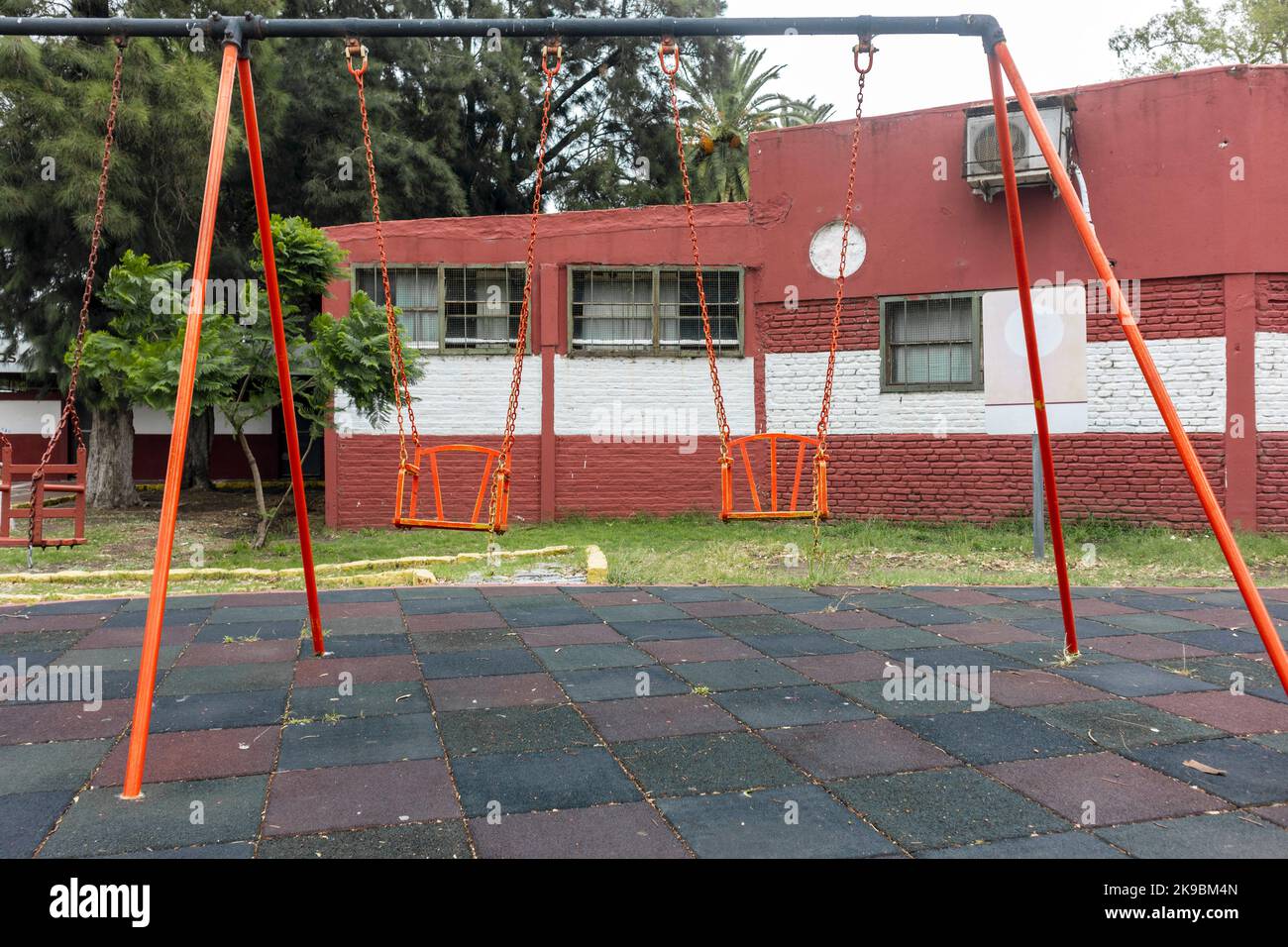 photo of old wooden swings in a playground Stock Photo - Alamy