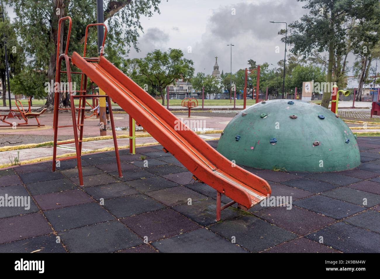 wooden and iron slide in a playground Stock Photo - Alamy
