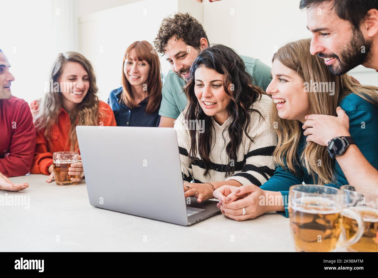 Students gathering around computer hi-res stock photography and images ...