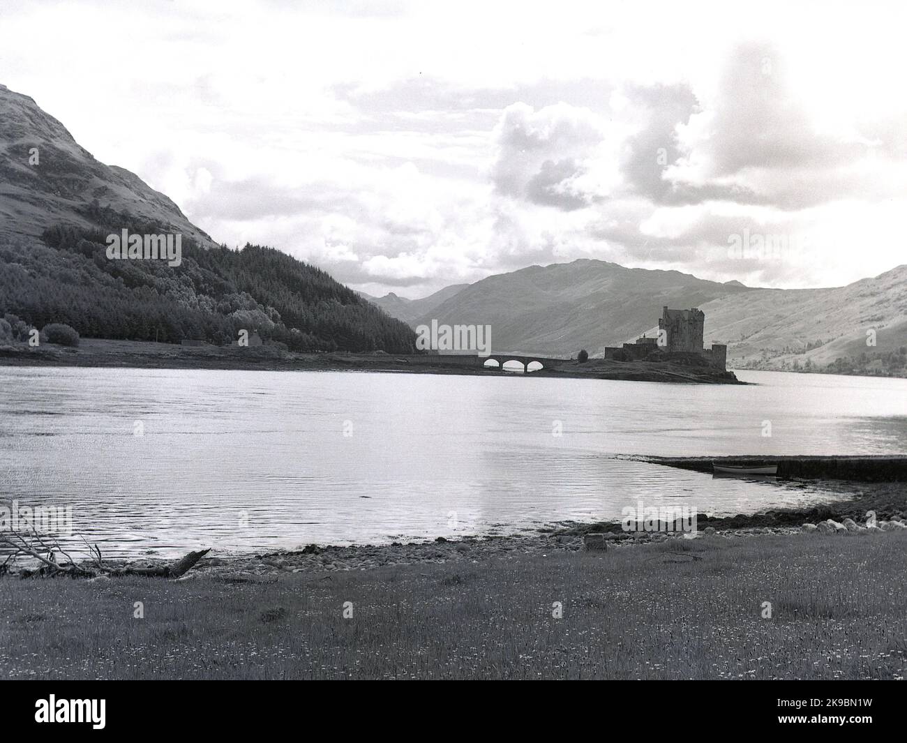 1956, historical picture, from a shore of a loch, of Eilean Donan ...