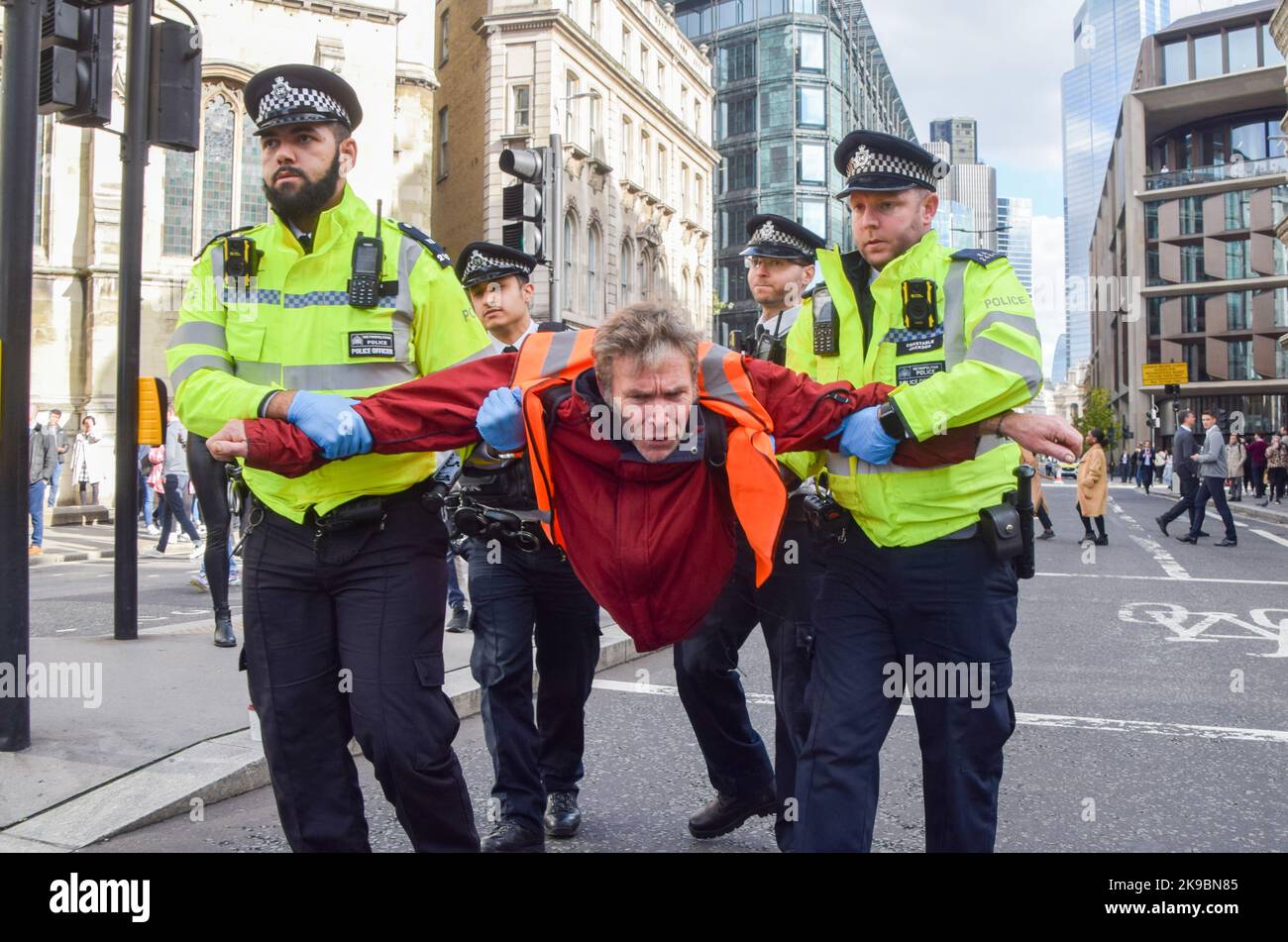 London, England, UK. 27th Oct, 2022. Police officers arrest a protester ...