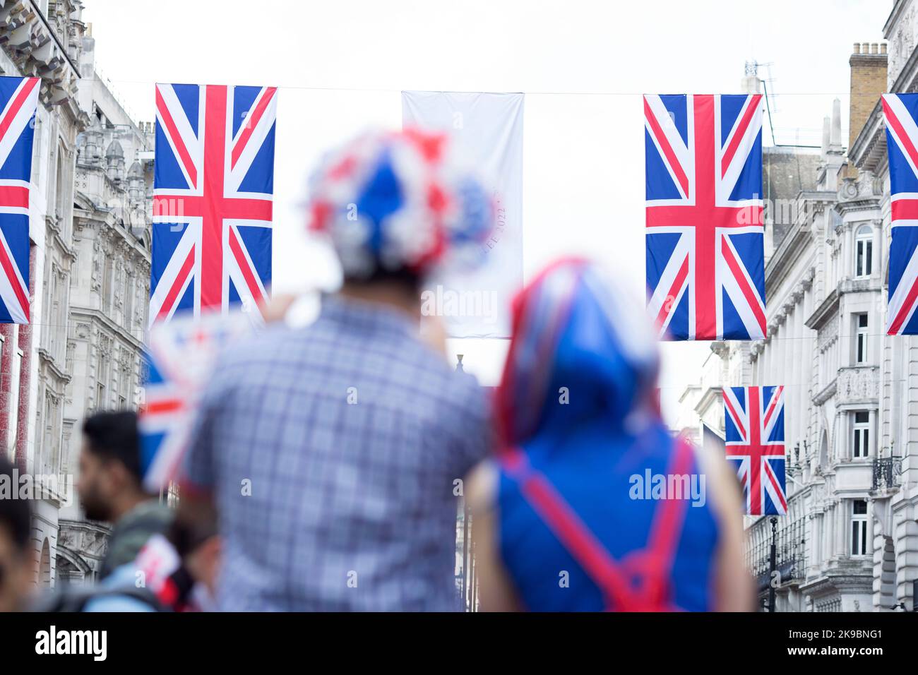 Revellers in Union Jack-themed costumes gather in Piccadilly Circus ...