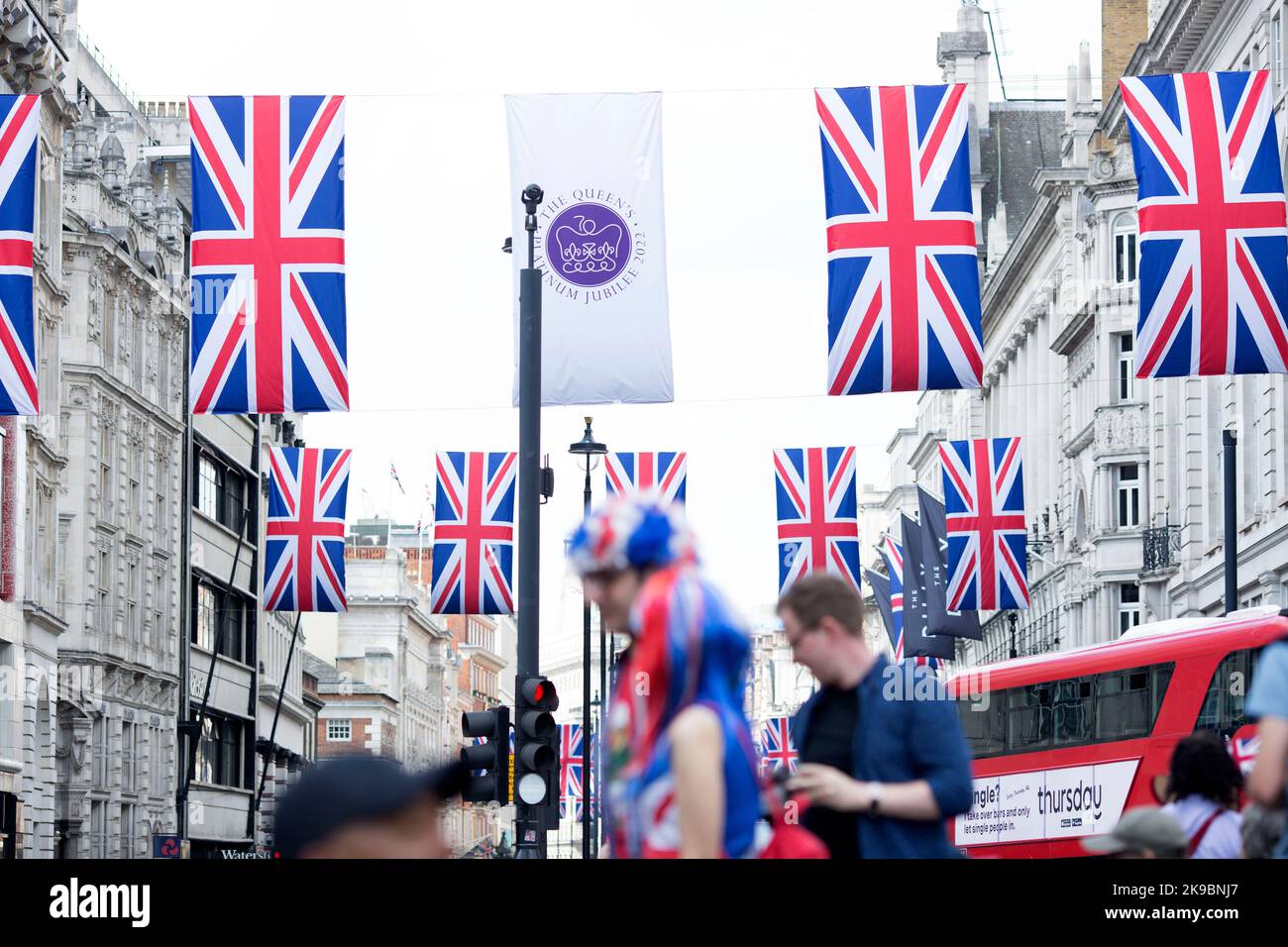 Revellers in Union Jack-themed costumes gather in Piccadilly Circus ...