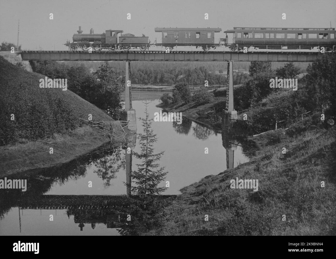 SDJ 9 with passenger train on the bridge over Nåsån.Sdj, Södra Dalarnes ...