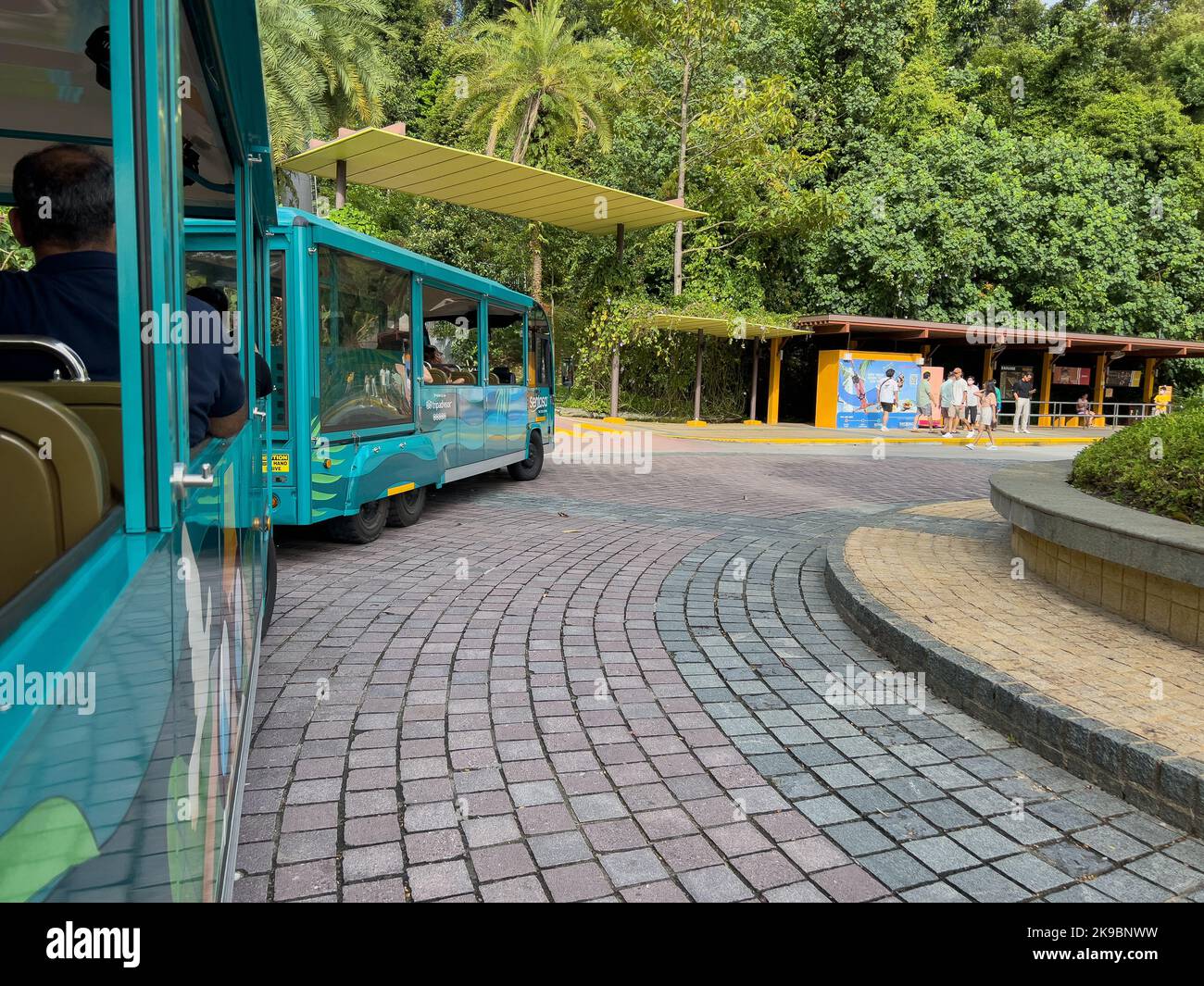 Point of view when traveling inside a beach shuttle vehicle at Sentosa ...
