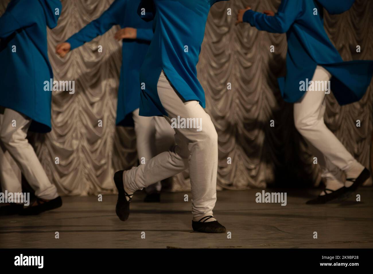 Children dancing in white pants. Performance on stage. Choreography ...