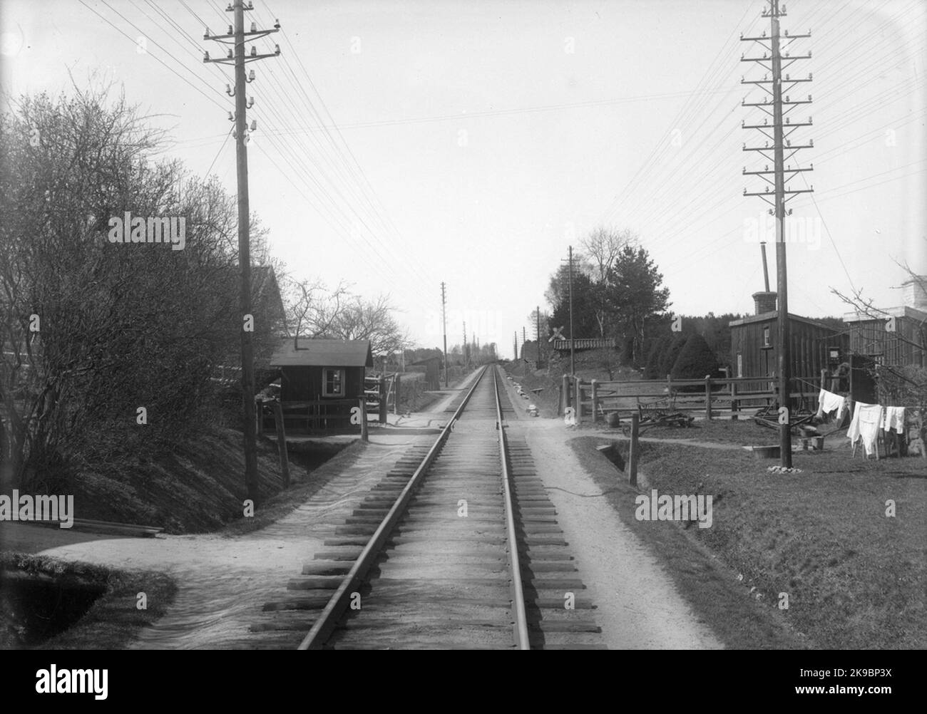 Road crossing with gates and guard cure Stock Photo - Alamy