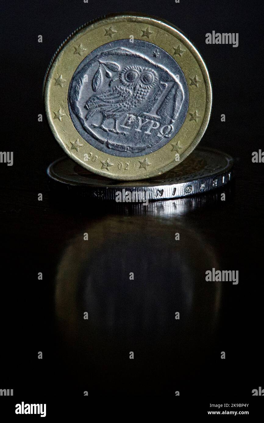 A 2002 Greek one euro coin with an owl symbol of the Greek mint in the ...