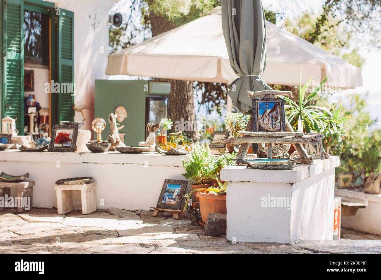 Corfu, Greece 2022.10.04. A painting shop outside on a concrete base ...