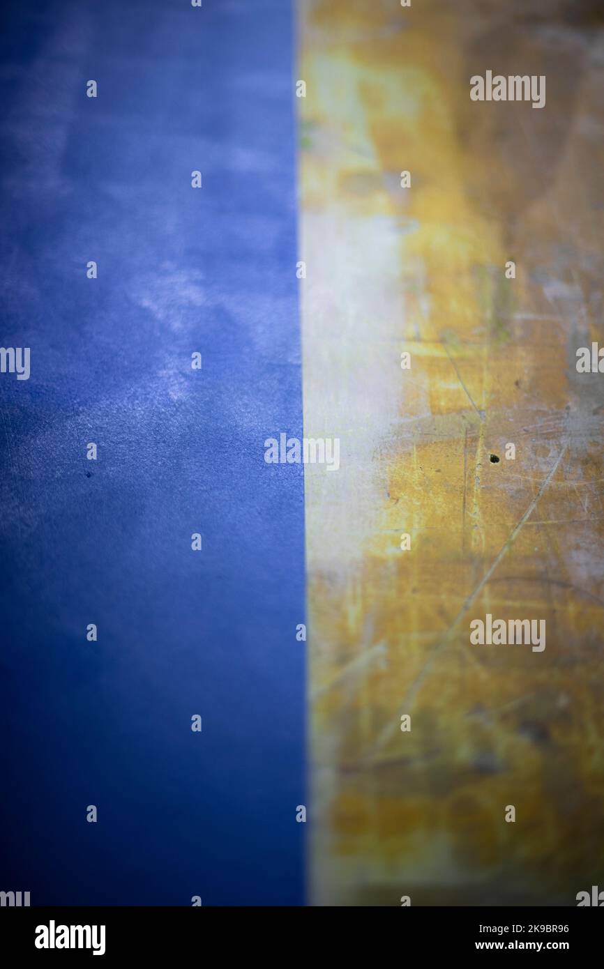 Blue texture and yellow. Table surface. Contrasting convergence of ...