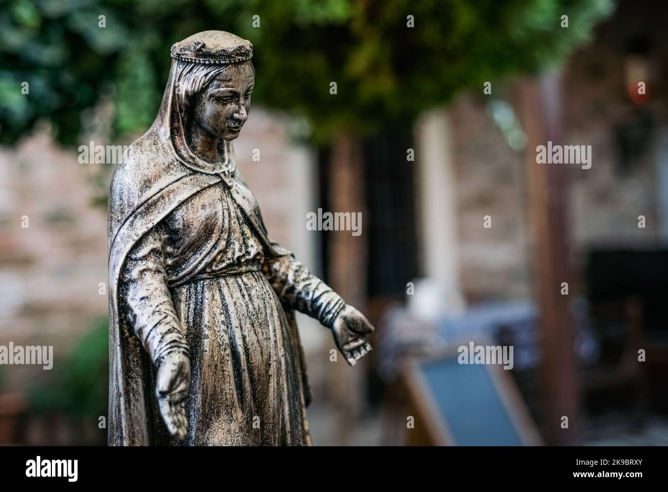 The Virgin Mary statue in front of a St. John The Baptist Church in ...