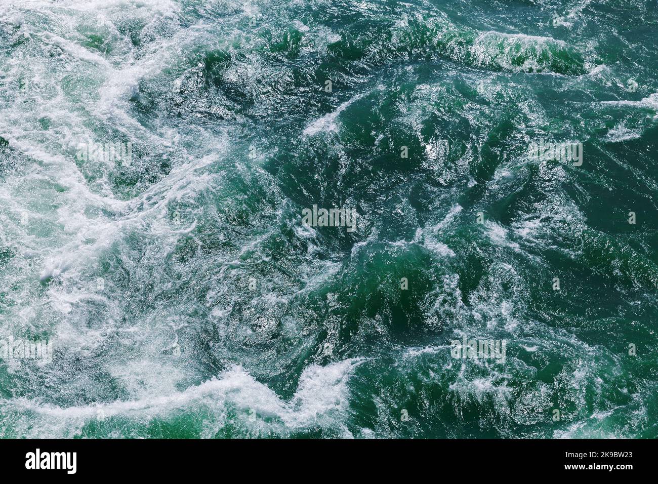 Stormy ocean water with waves and foam, top view, natural background ...
