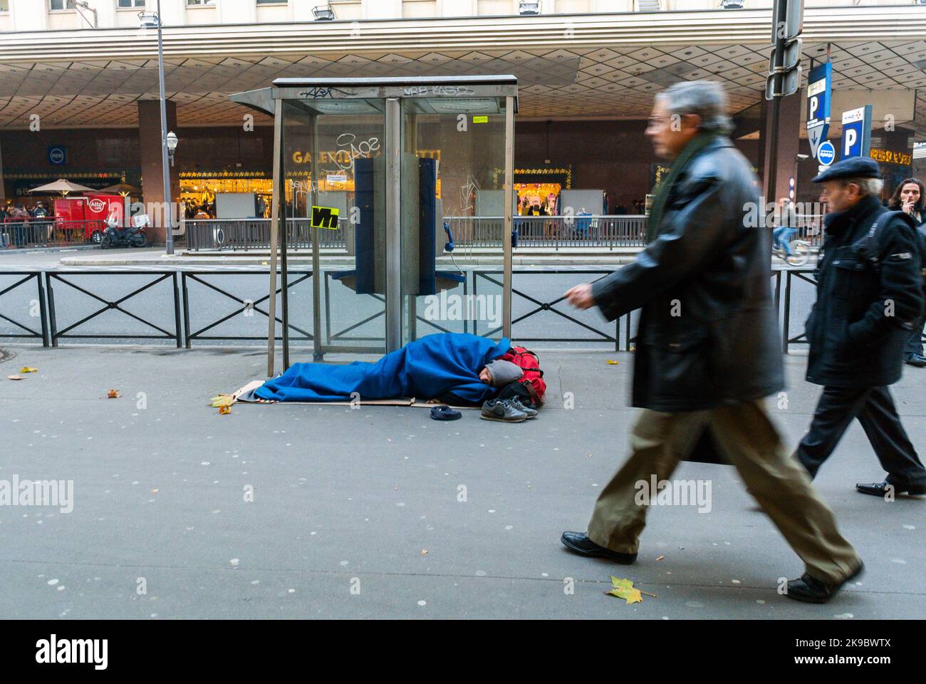 Paris, France, Homeless man Sleeping on Sidewalk on Busy Street ...