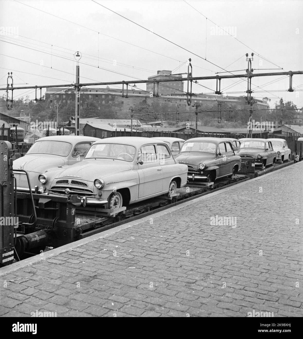 Cars are transported on rail wagon Stock Photo - Alamy