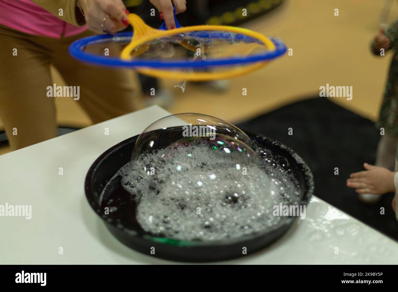 Bubbles. Soap solution for inflatable bubbles. Liquid for entertainment ...