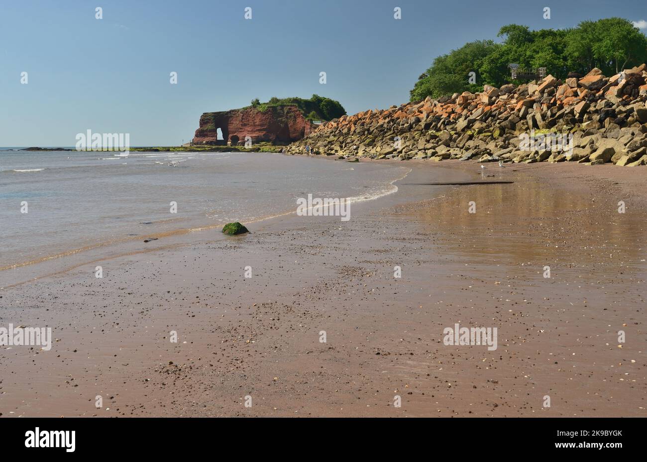 Langstone Rock and rock armour along the seawall at Dawlish Warren ...