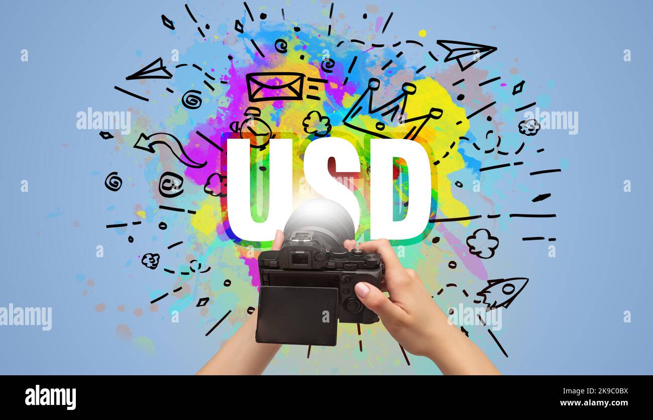 Close-up of a hand holding digital camera with abstract drawing Stock ...