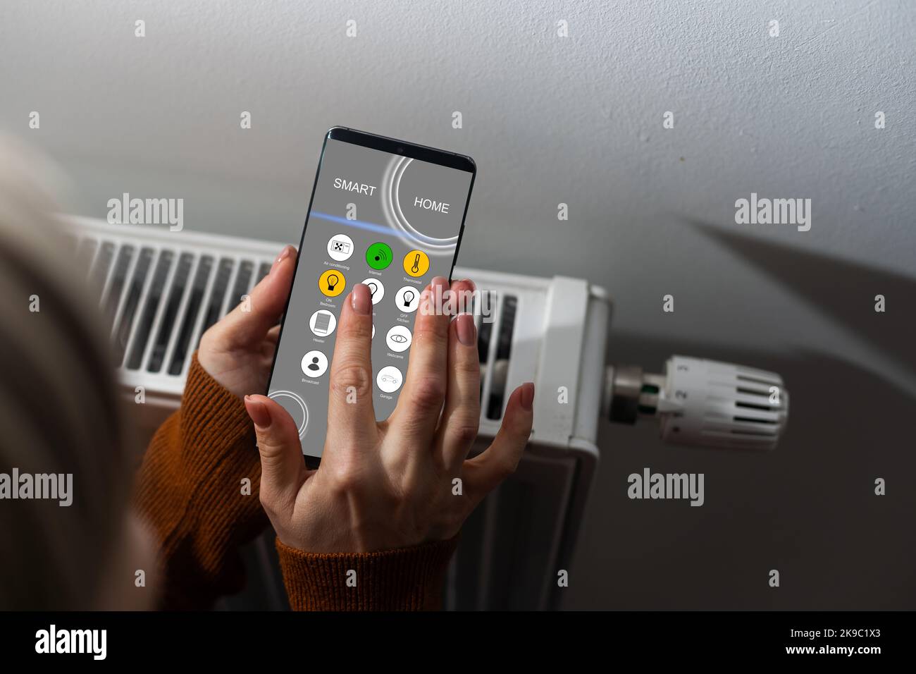 Smartphone with launched application for air temperature adjustment ...
