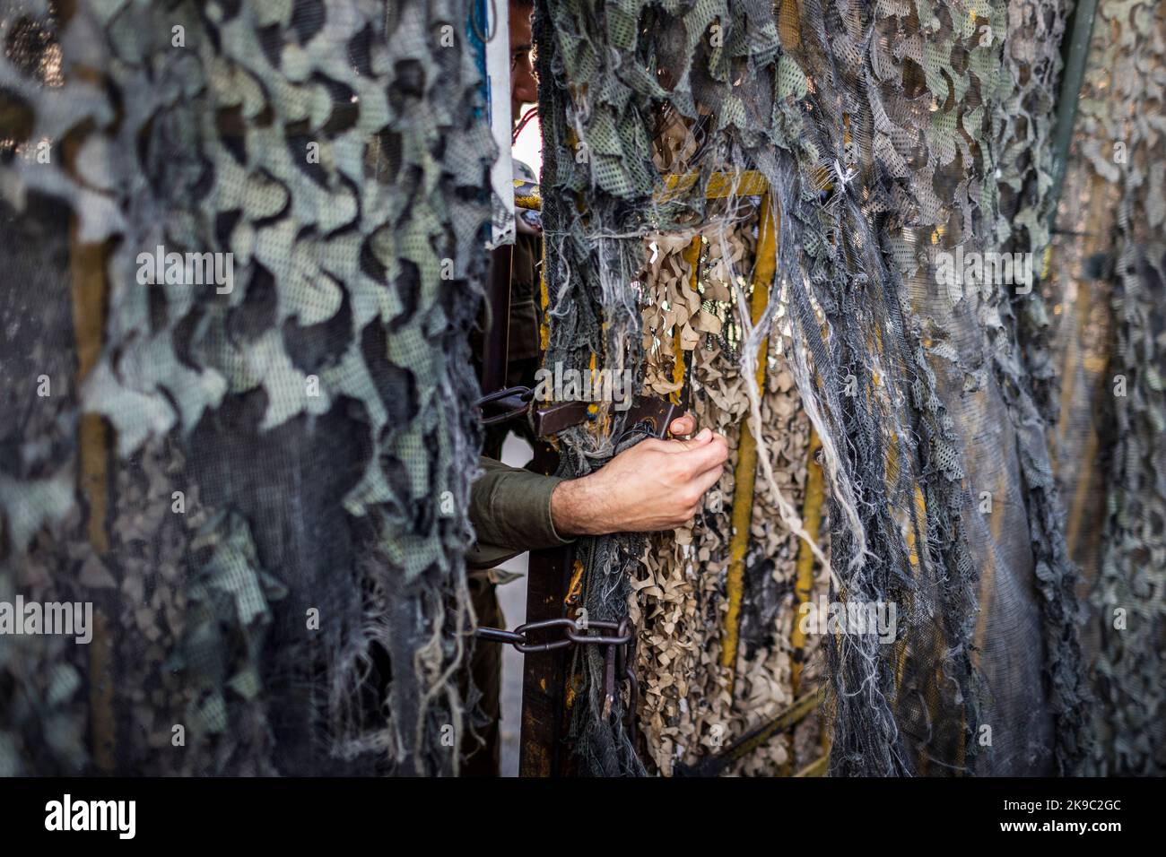 Rosh Ha Nikra, Israel. 27th Oct, 2022. An Israeli soldier unlocks the ...