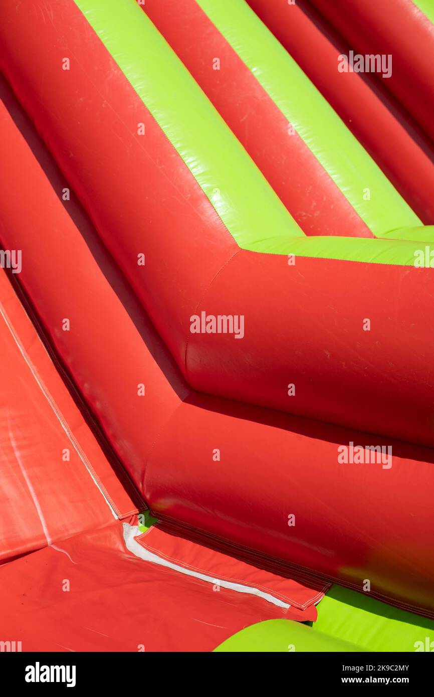 Inflatable slide of red color. Slide for children. Playground. Air ...