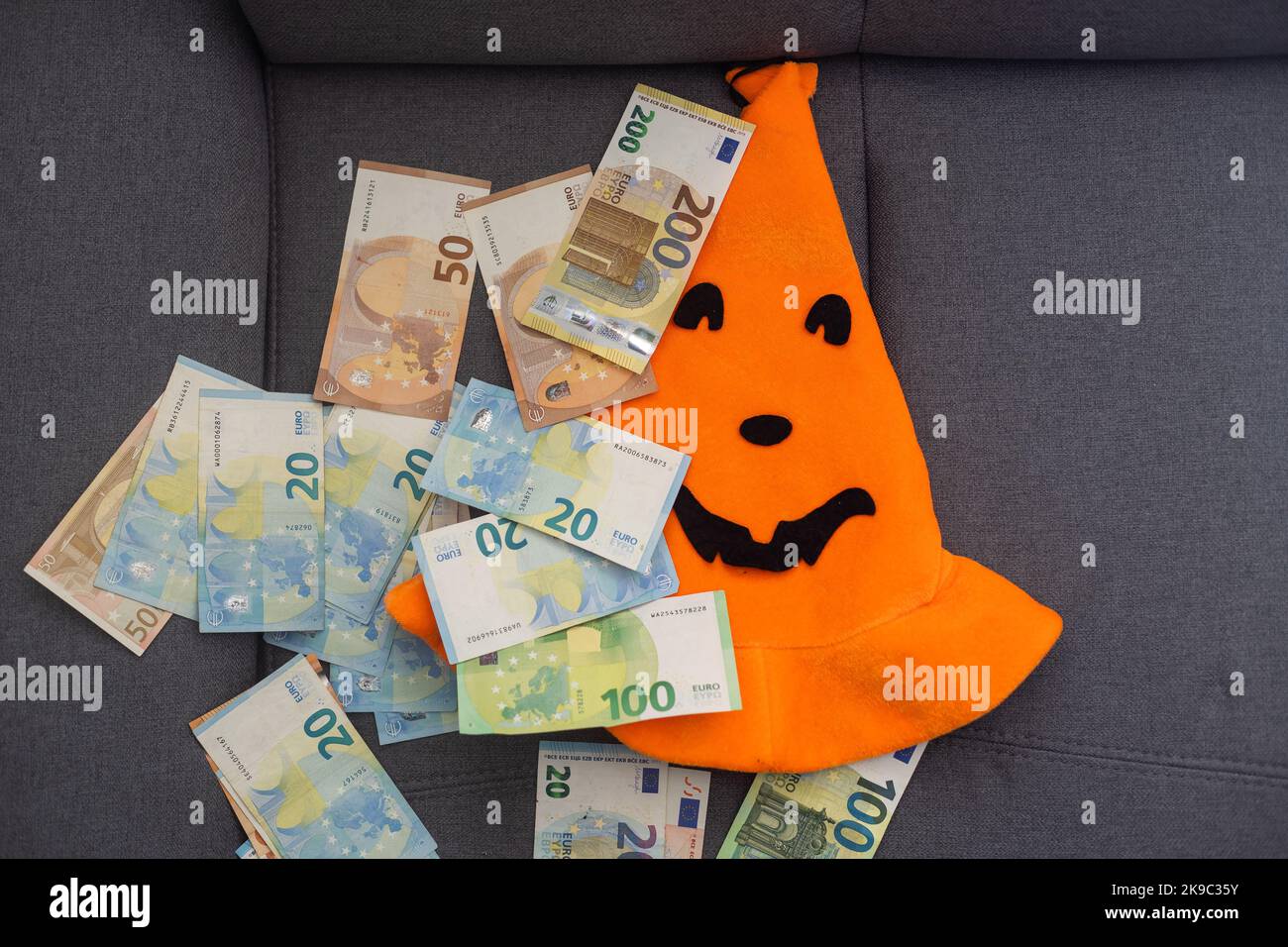 Euro banknotes and Halloween hat Stock Photo - Alamy