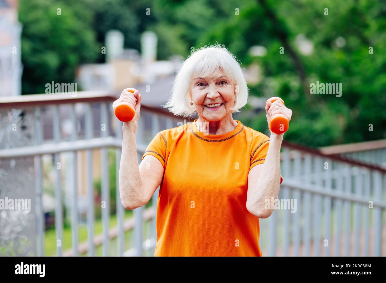 Beautiful sportive senior woman training outdoors - Mature adults old ...