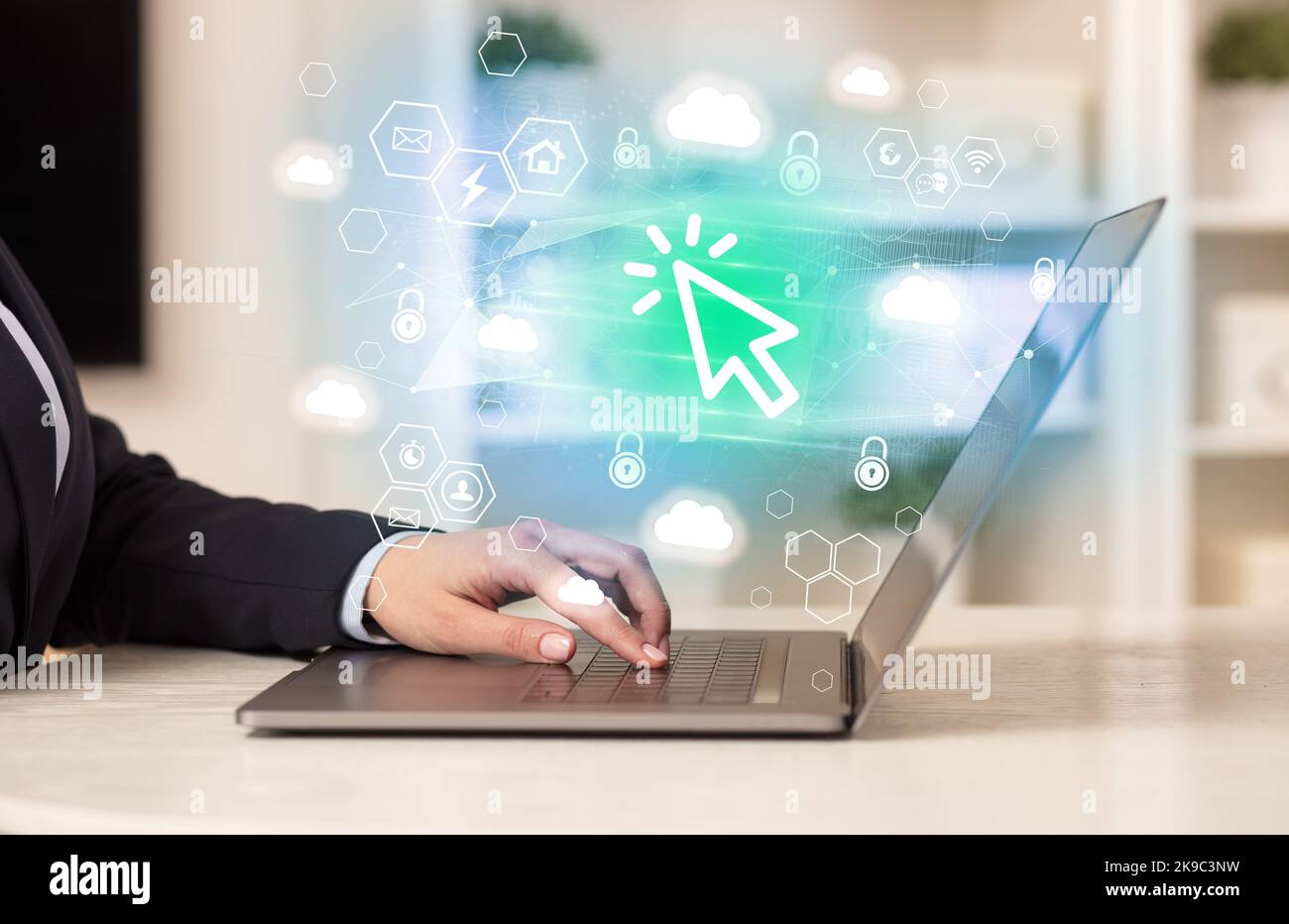 Hands working on laptop with digital icons Stock Photo - Alamy