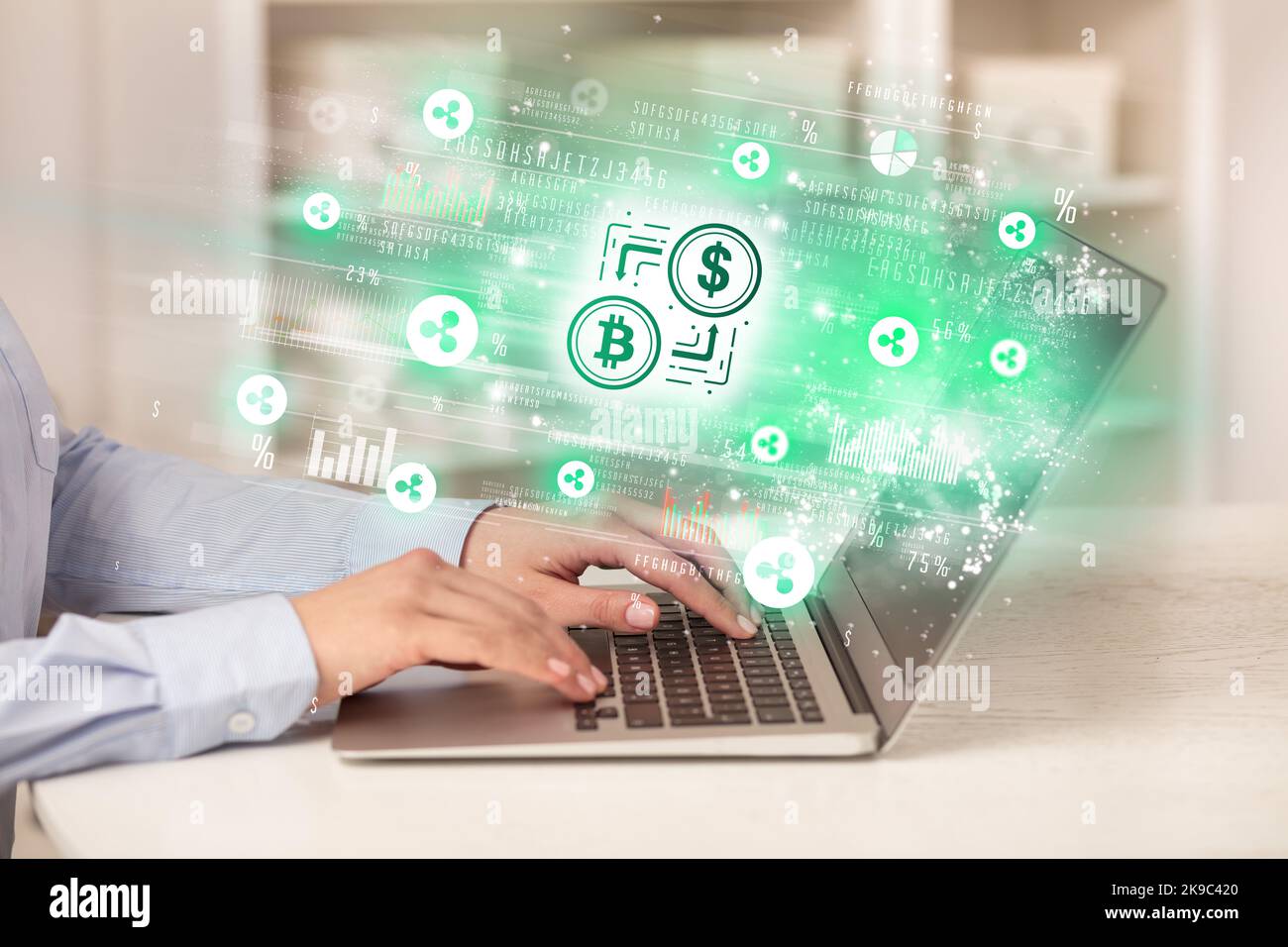 Young man watching stock market on laptop Stock Photo - Alamy
