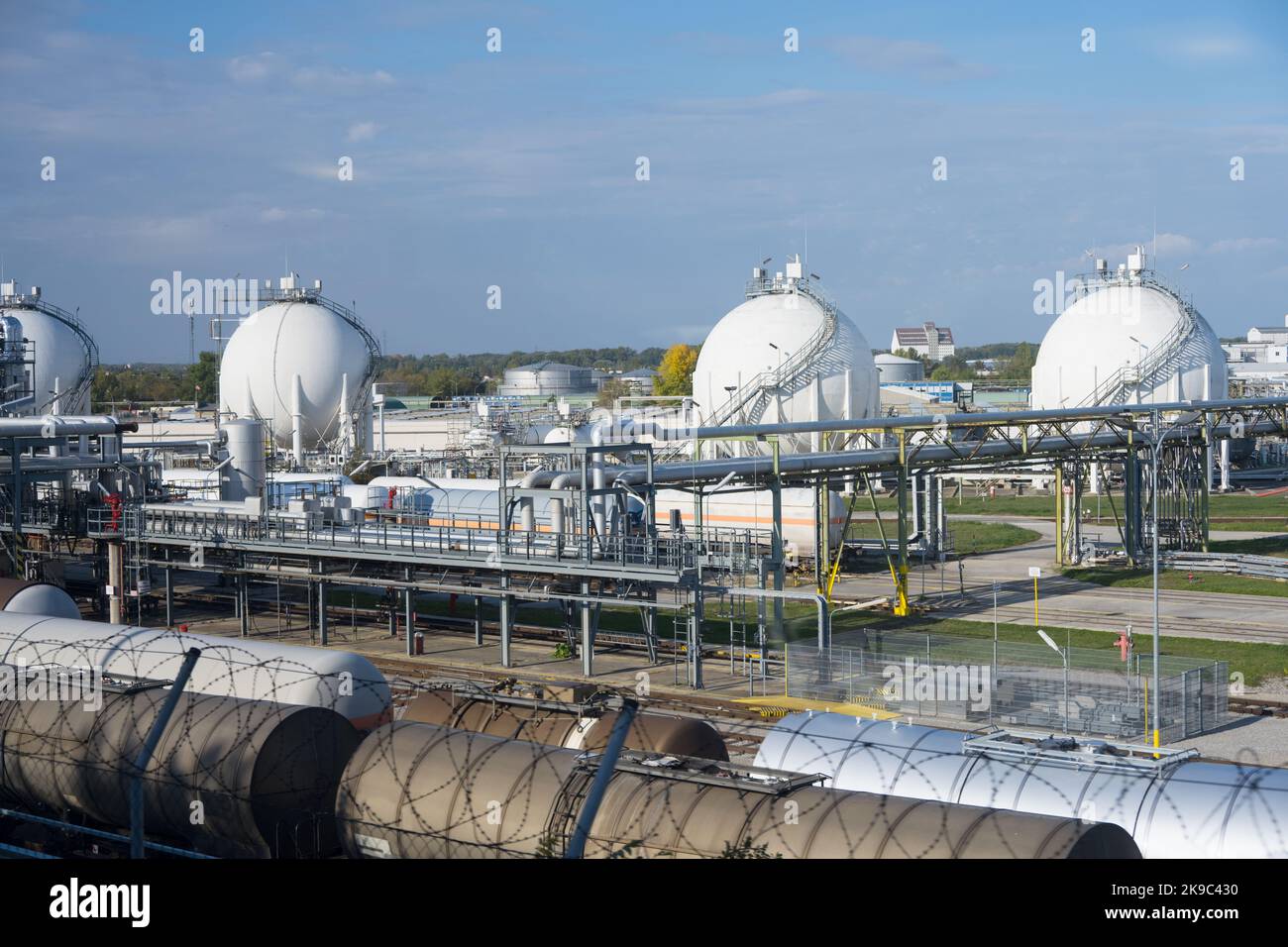 Large round storage tanks in a modern fossil fuel oil refinery as ...
