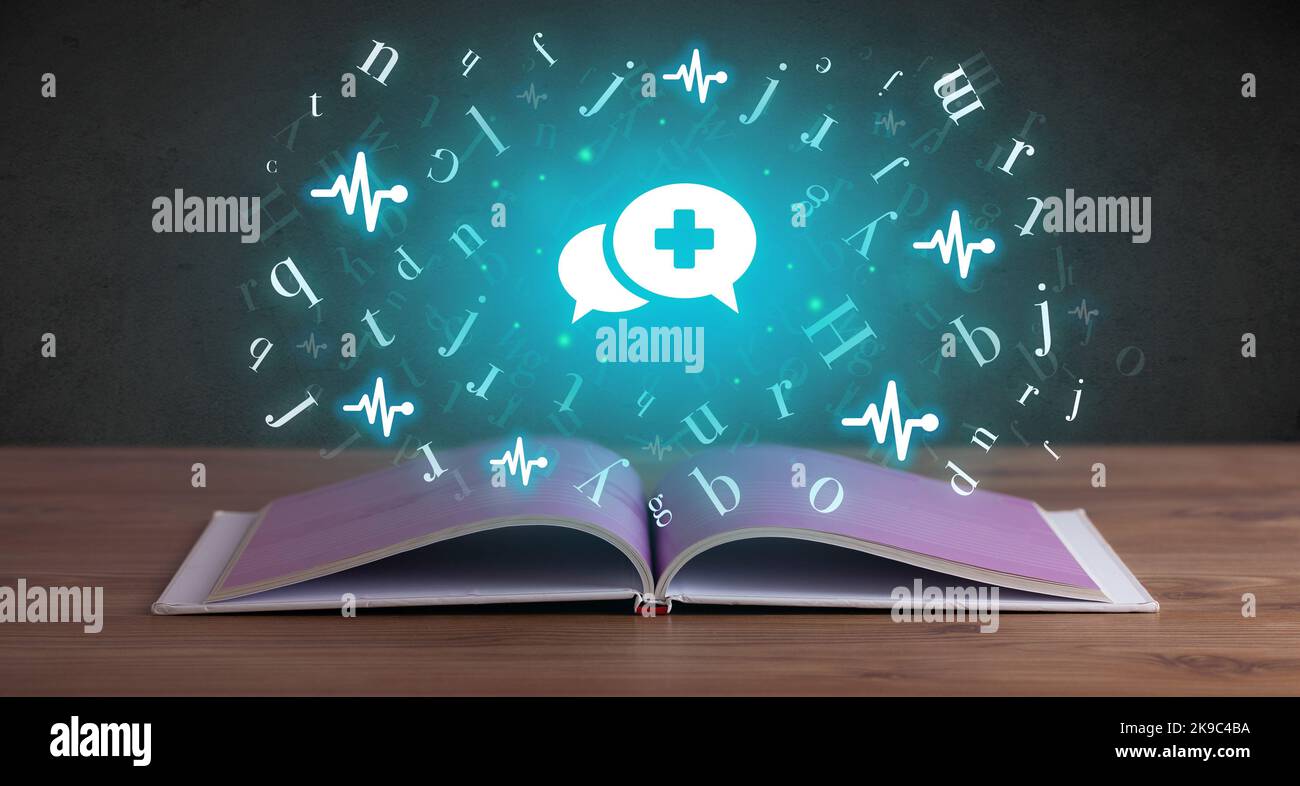 Open medical book with health icons above Stock Photo - Alamy