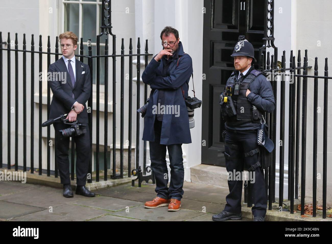 Simon Walker (C) outside No 11 Downing Street waiting for the arrival ...
