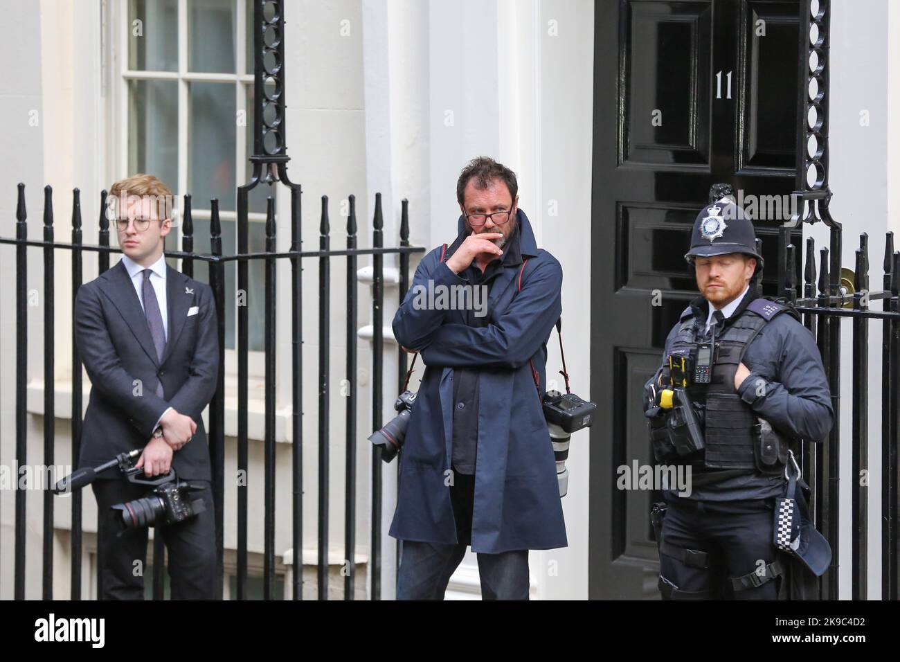 Simon Walker (C) outside No 11 Downing Street waiting for the arrival ...