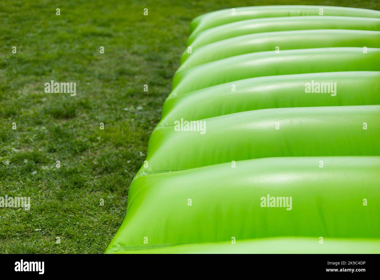 Inflatable design. Trampoline for jumping. Green material. Air three ...
