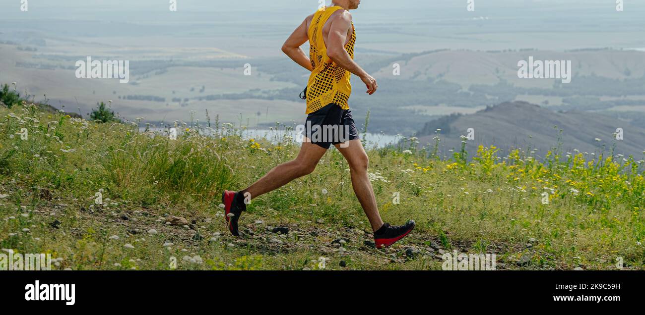 male athlete running cross country race Stock Photo - Alamy